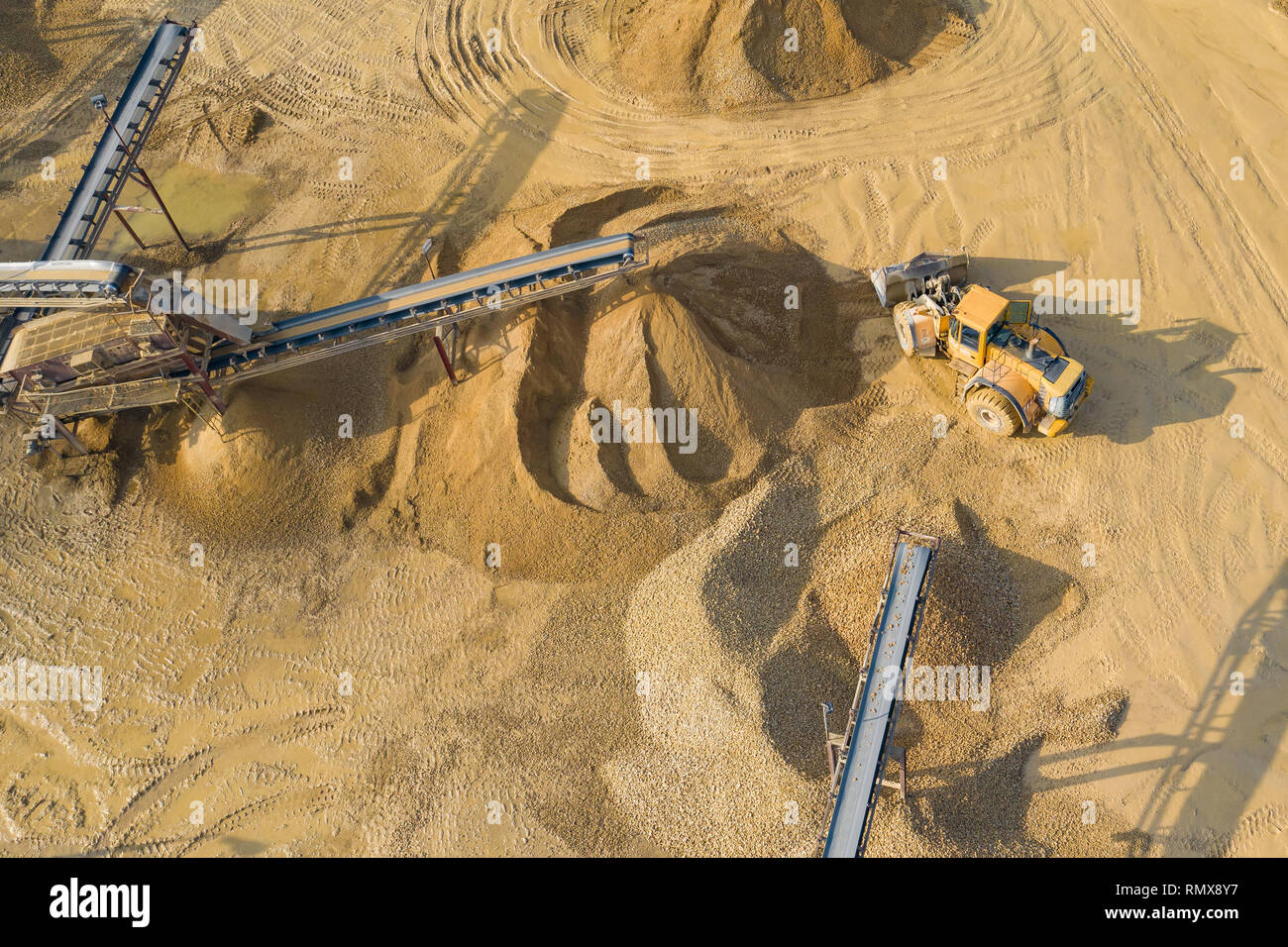 Aerial view of sandpit and factory plant producing sand materials for ...