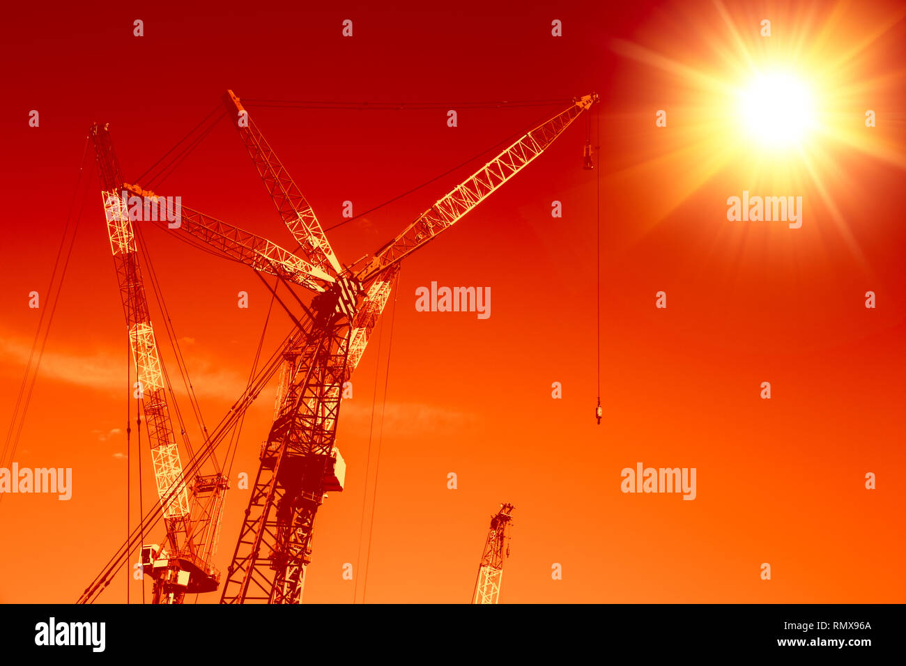 Sunset industrial cranes industry hi-res stock photography and images ...