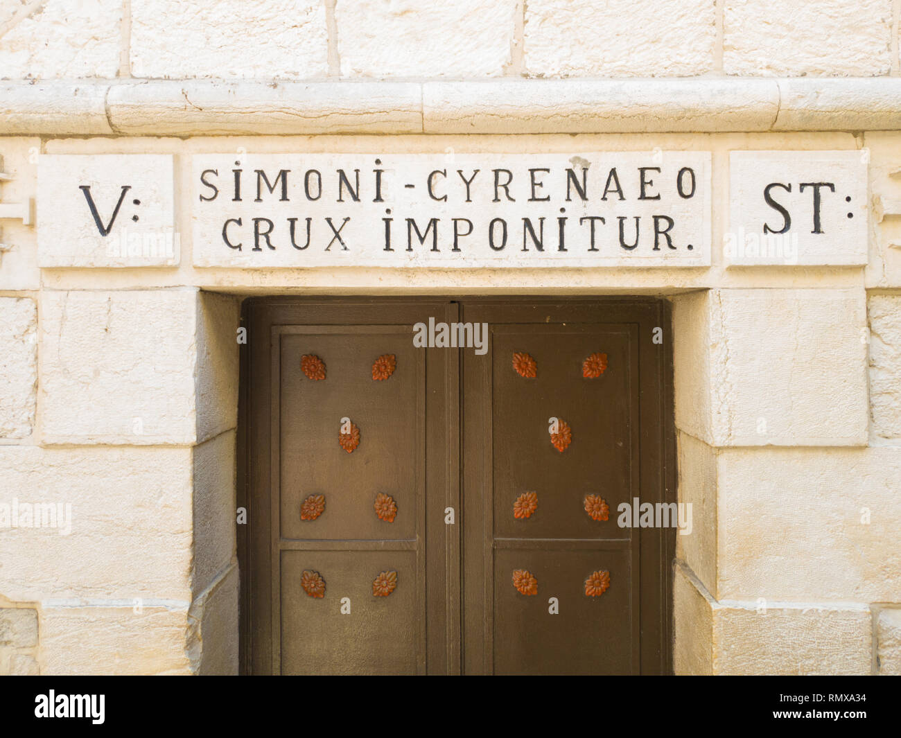 Detail of a sign indicating the point where "Simon of Cyrene gave the ...