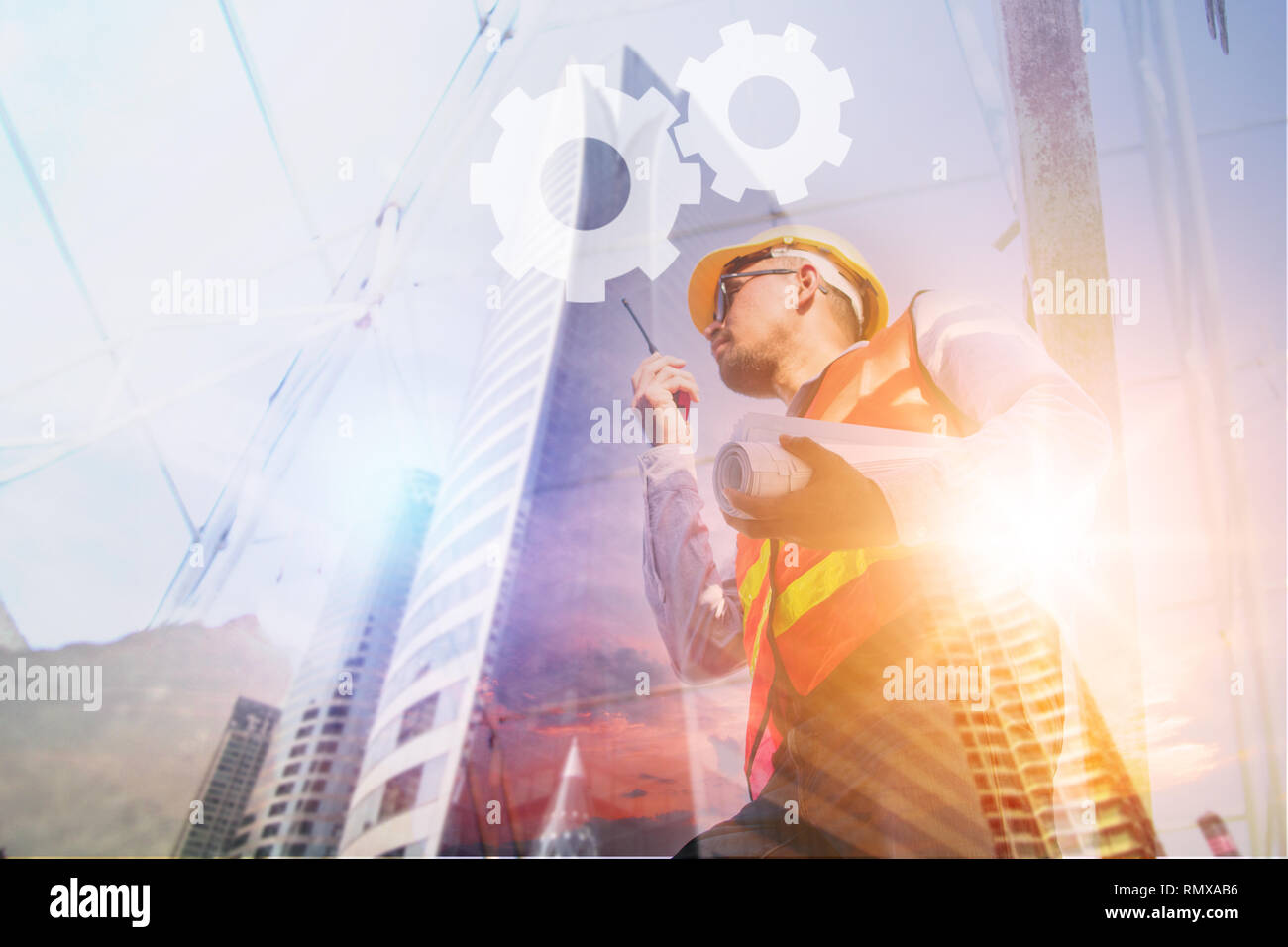 Construction concept, exposure of engineer talking on radio with tower ...