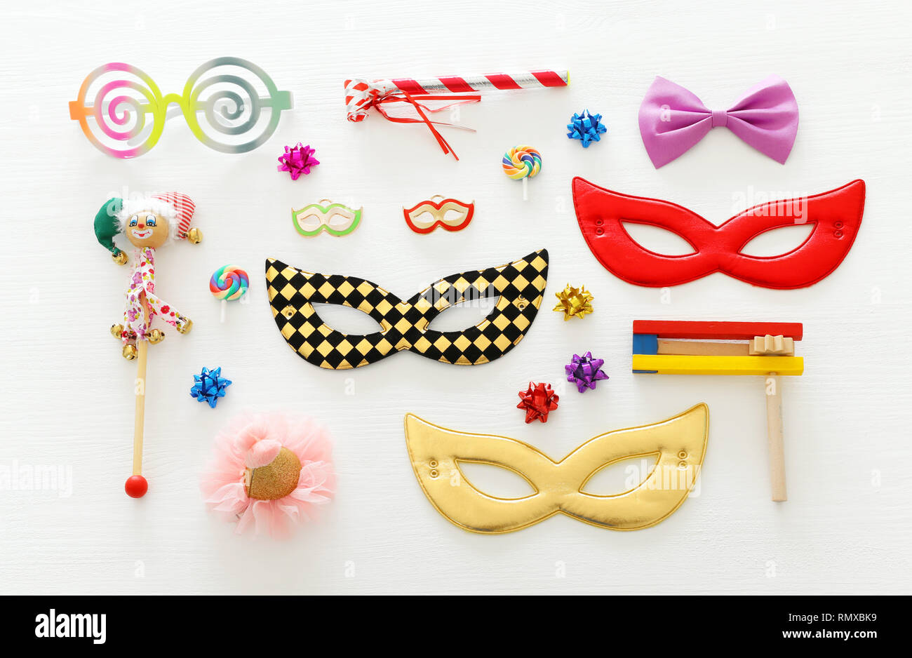 Purim celebration concept (jewish carnival holiday) over wooden white ...