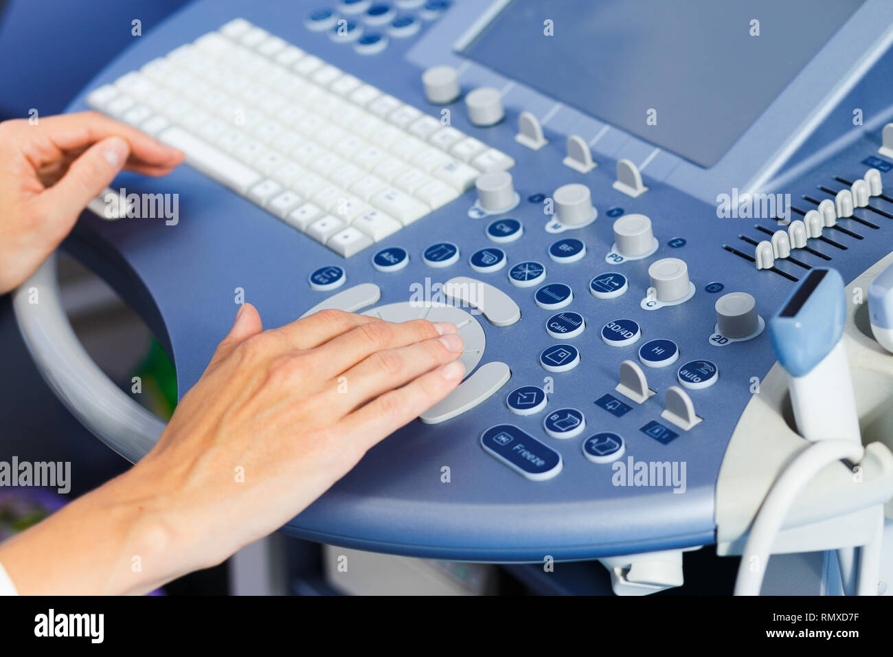 Gynecologist uses ultrasound scanner hi-res stock photography and ...
