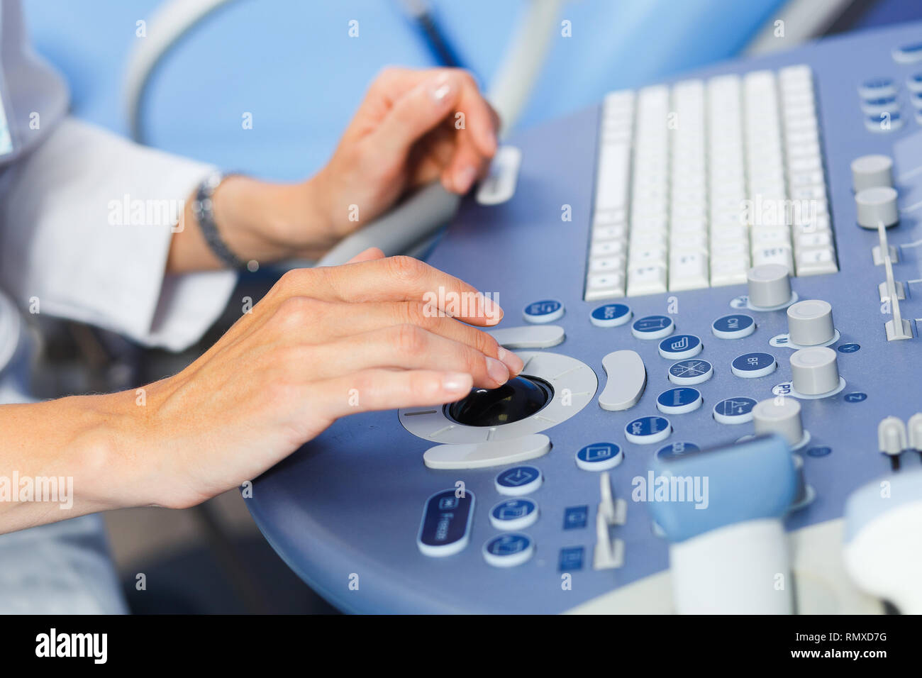 Gynecologist uses ultrasound scanner hi-res stock photography and ...