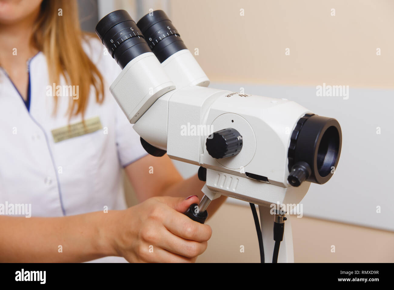 woman gynecologist working with colposcope in clinic Stock Photo - Alamy