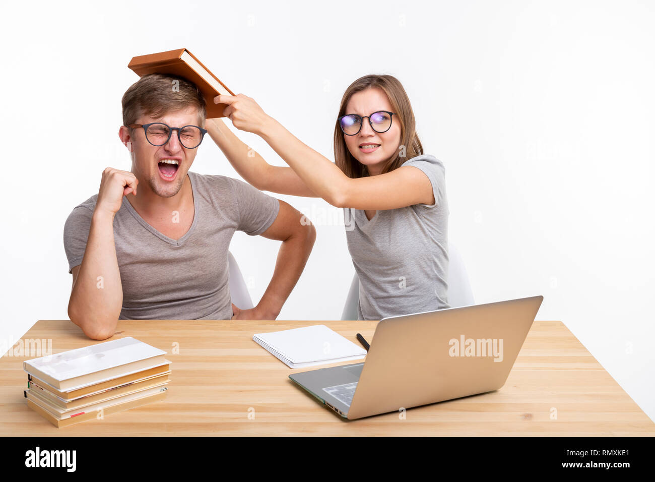 People and education concept - Two students have fun while working ...