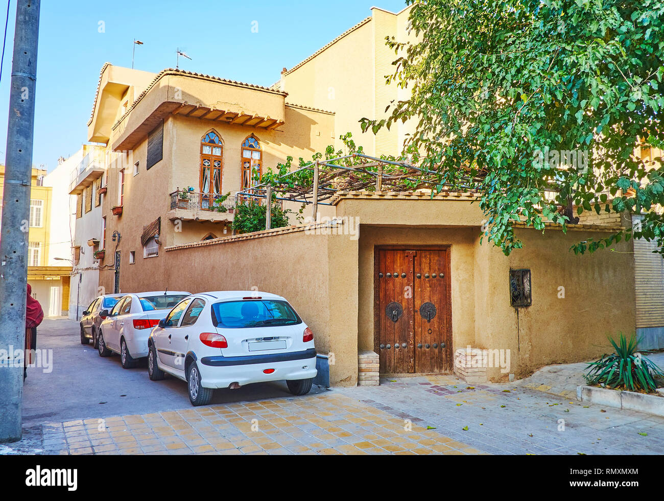 The quiet street of New Julfa Armenian neighborhood with typical houses ...
