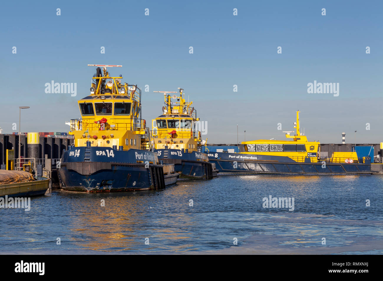 Fire fighting boats of the port of Rotterdam are docked on the side of ...
