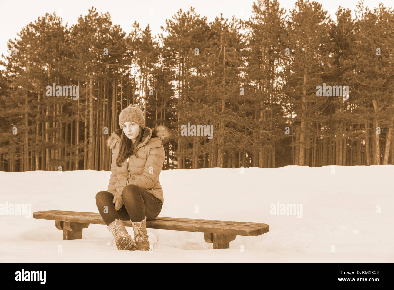 Beautiful girl modeling on snow Stock Photo - Alamy
