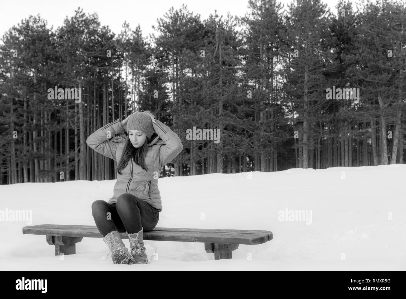 Beautiful girl modeling on snow Stock Photo - Alamy