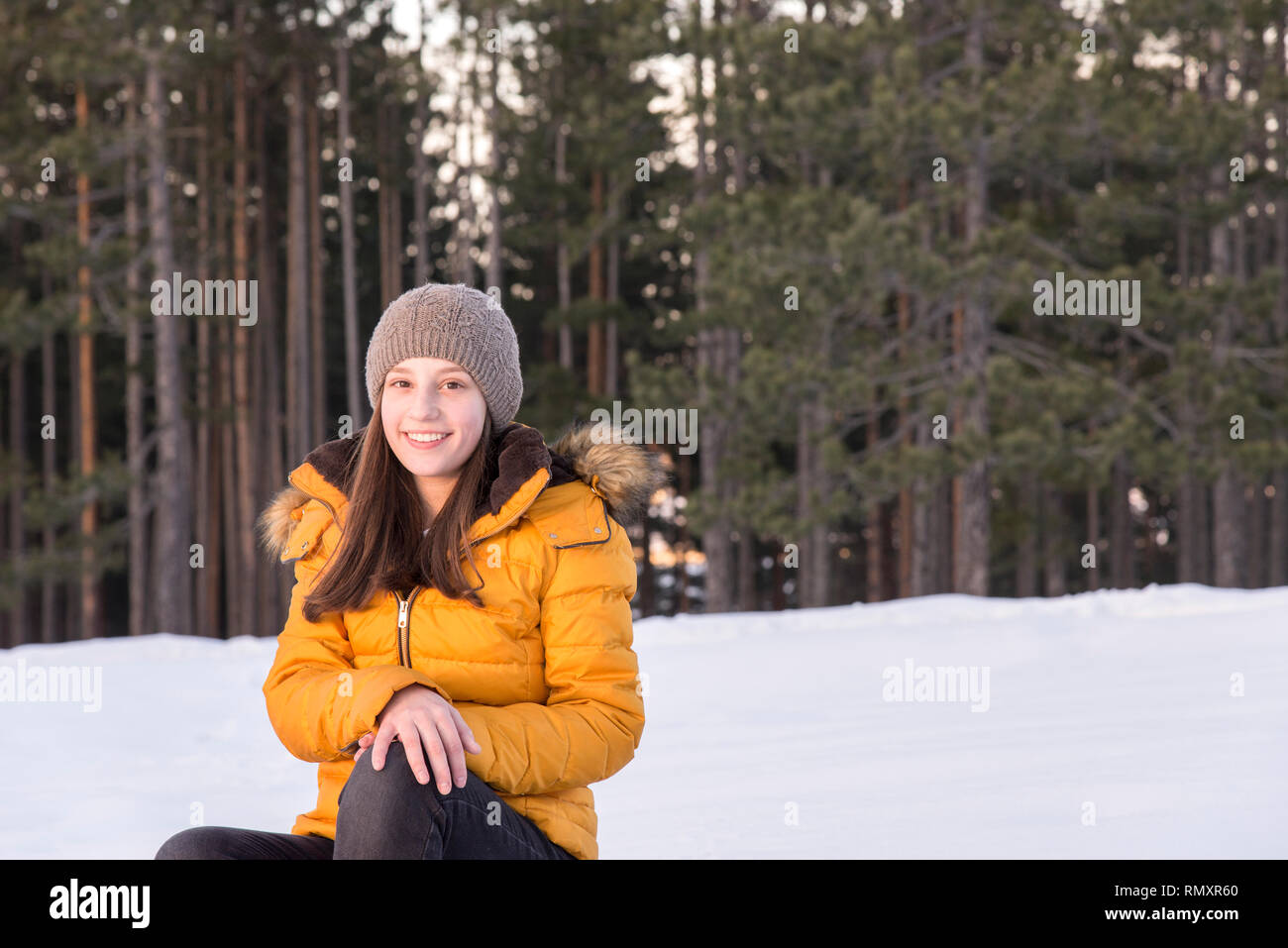 Beautiful girl modeling on snow Stock Photo - Alamy