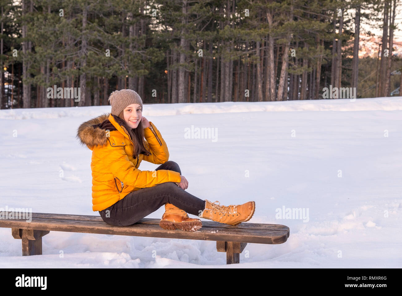 Beautiful girl modeling on snow Stock Photo - Alamy