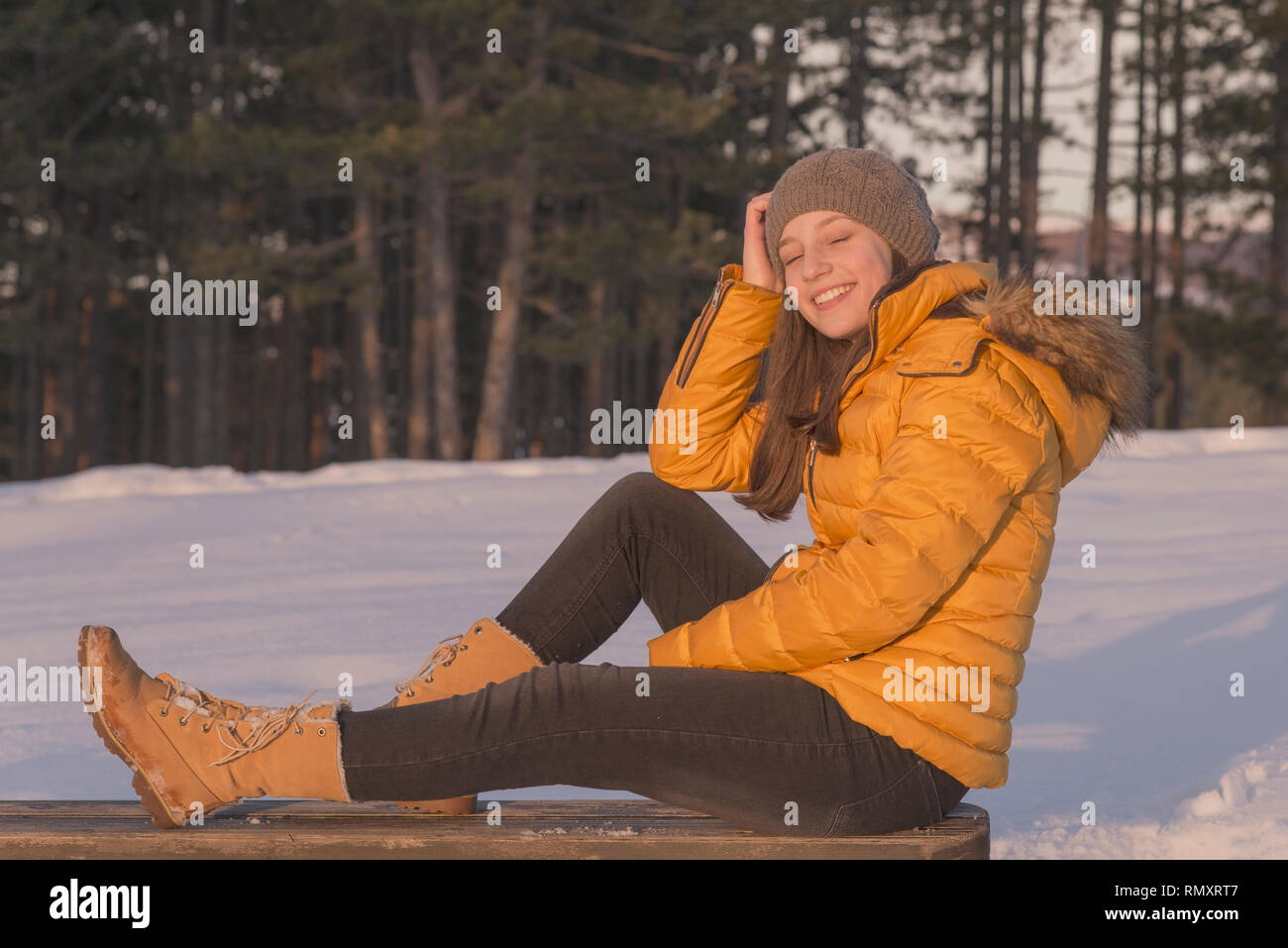 Beautiful girl modeling on snow Stock Photo - Alamy