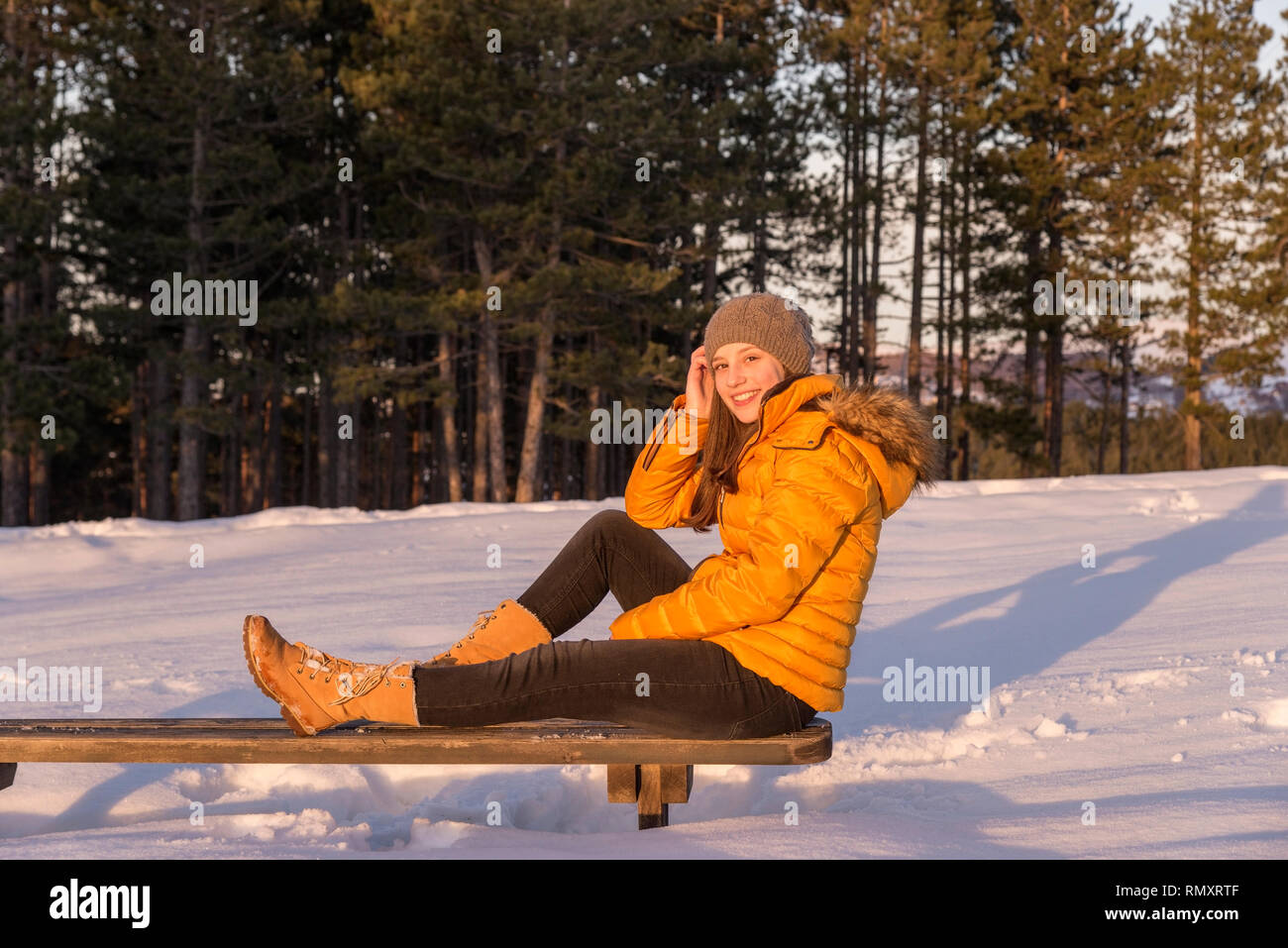 Beautiful girl modeling on snow Stock Photo - Alamy