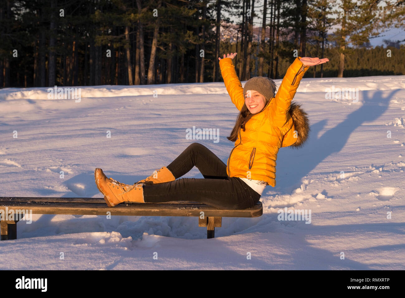 Beautiful girl modeling on snow Stock Photo - Alamy