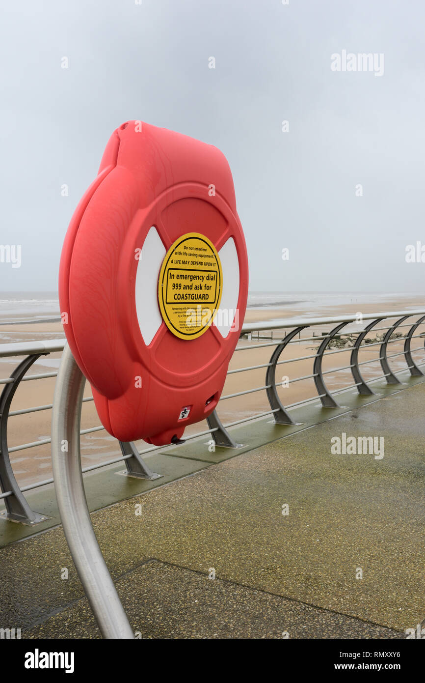 Lifebuoy station mounted in front of stainless steel balustrade guard ...