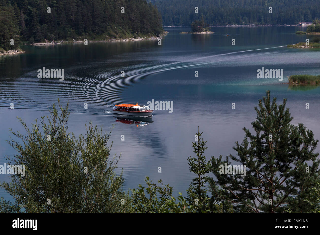 silent boat on lake Eibsee Bavaria Stock Photo - Alamy