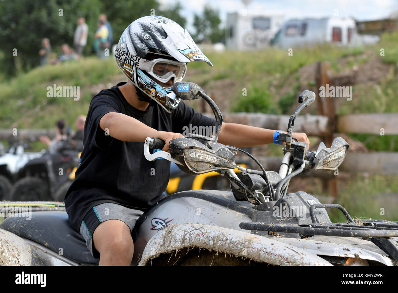A young boy riding a quad/ATV offroad Stock Photo - Alamy