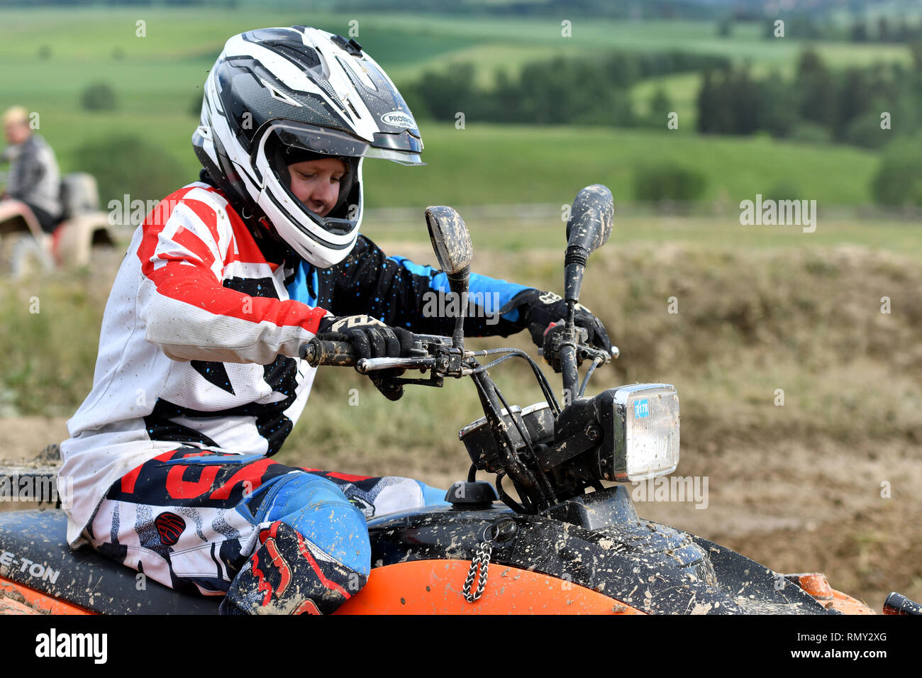 A young boy riding a quad/ATV offroad Stock Photo - Alamy