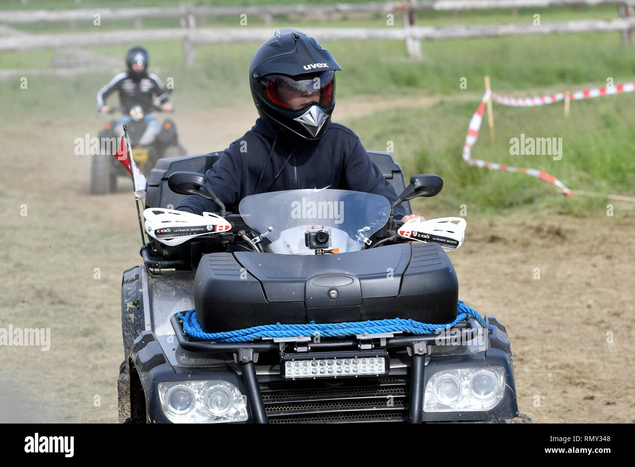 A young boy riding a quad/ATV offroad Stock Photo - Alamy