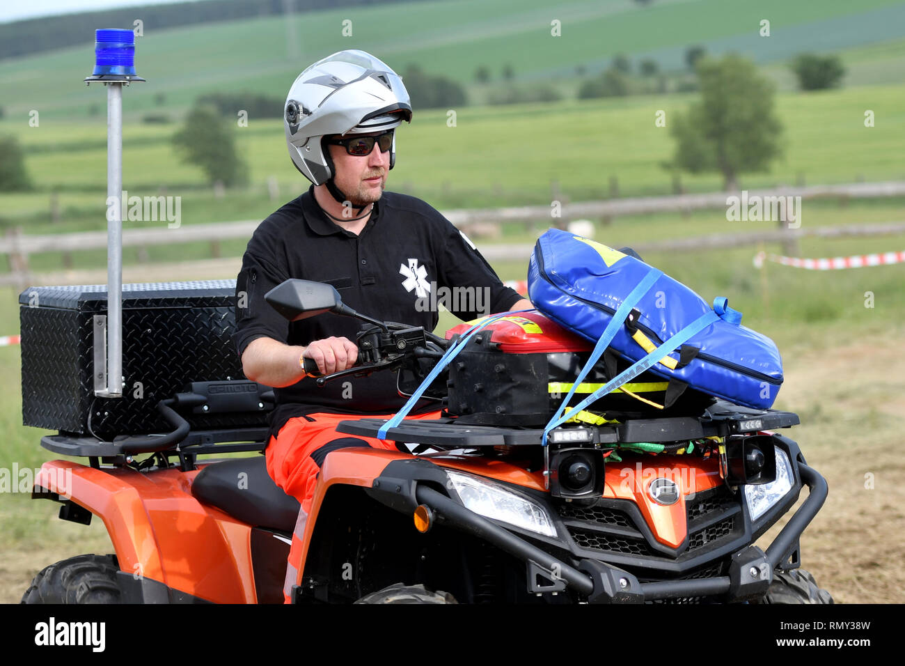 Medical team riding a quad/ATV offroad Stock Photo - Alamy