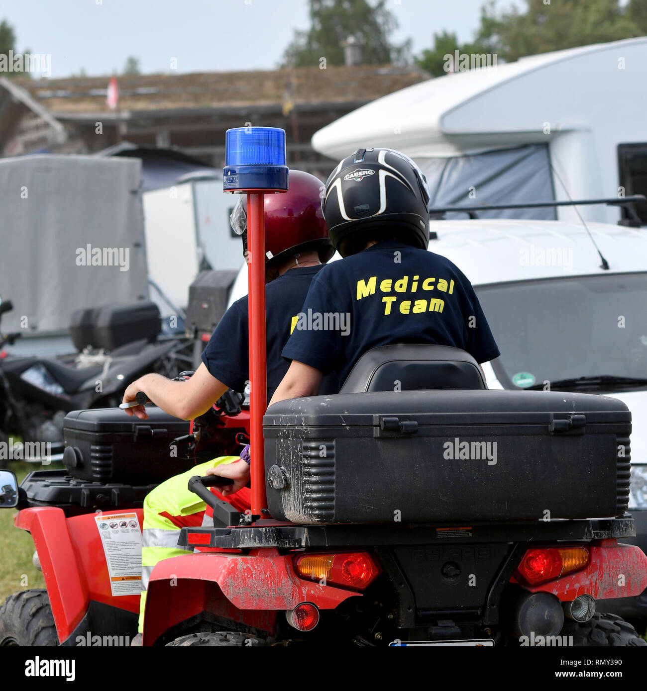 Medical team riding a quad/ATV offroad Stock Photo - Alamy