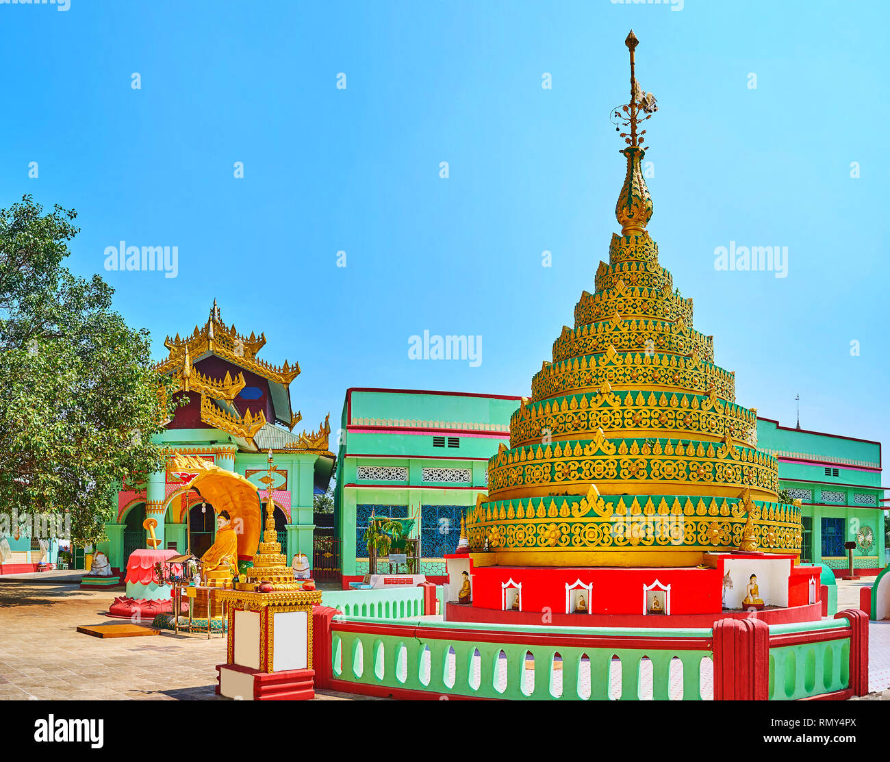 The colorful stupa, decorated with intricate gild pattern and topped ...