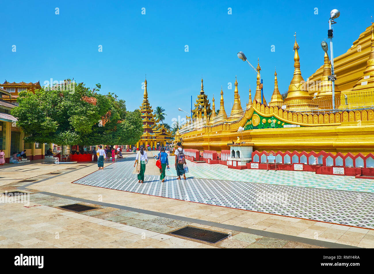 BAGO, MYANMAR - FEBRUARY 15, 2018: The Buddhist devotees walk around ...