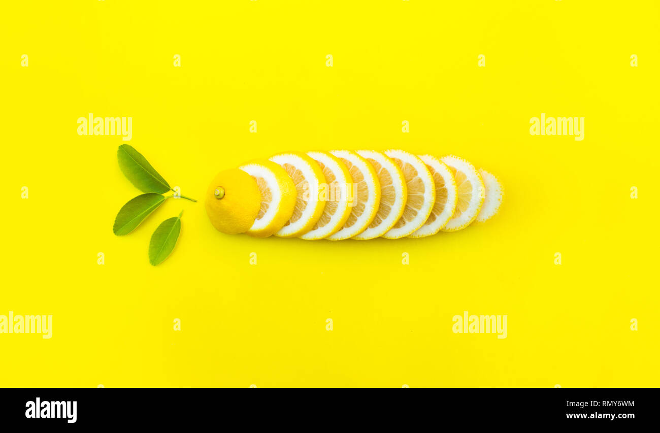 Top view of lemon and leaves on yellow color background.concepts ideas ...