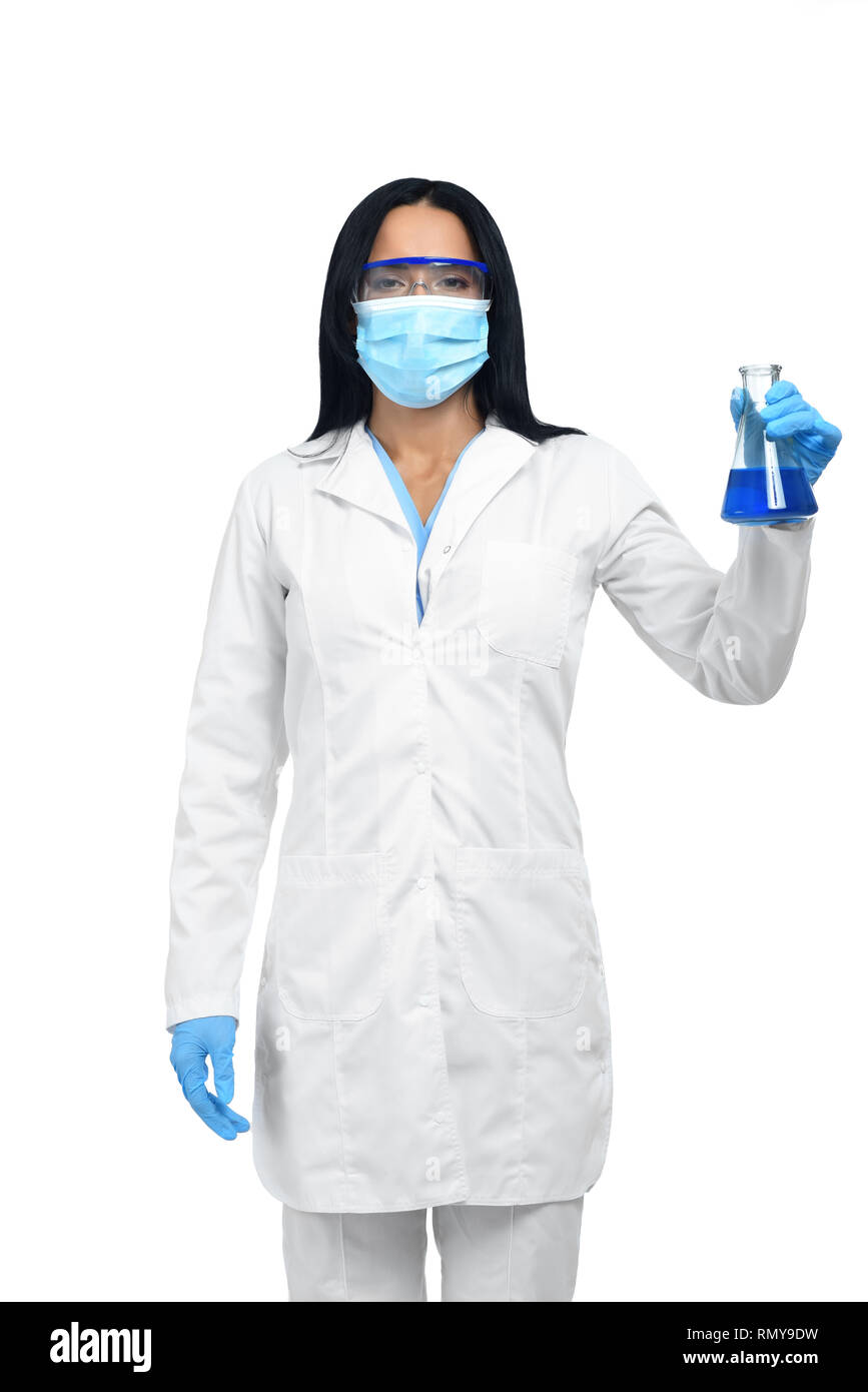 Woman with black hair in white lab coat looking at camera. Young ...