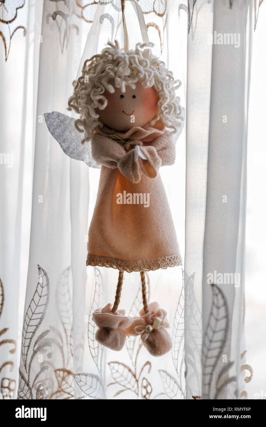 little rag interior doll angel closeup against the window Stock Photo ...