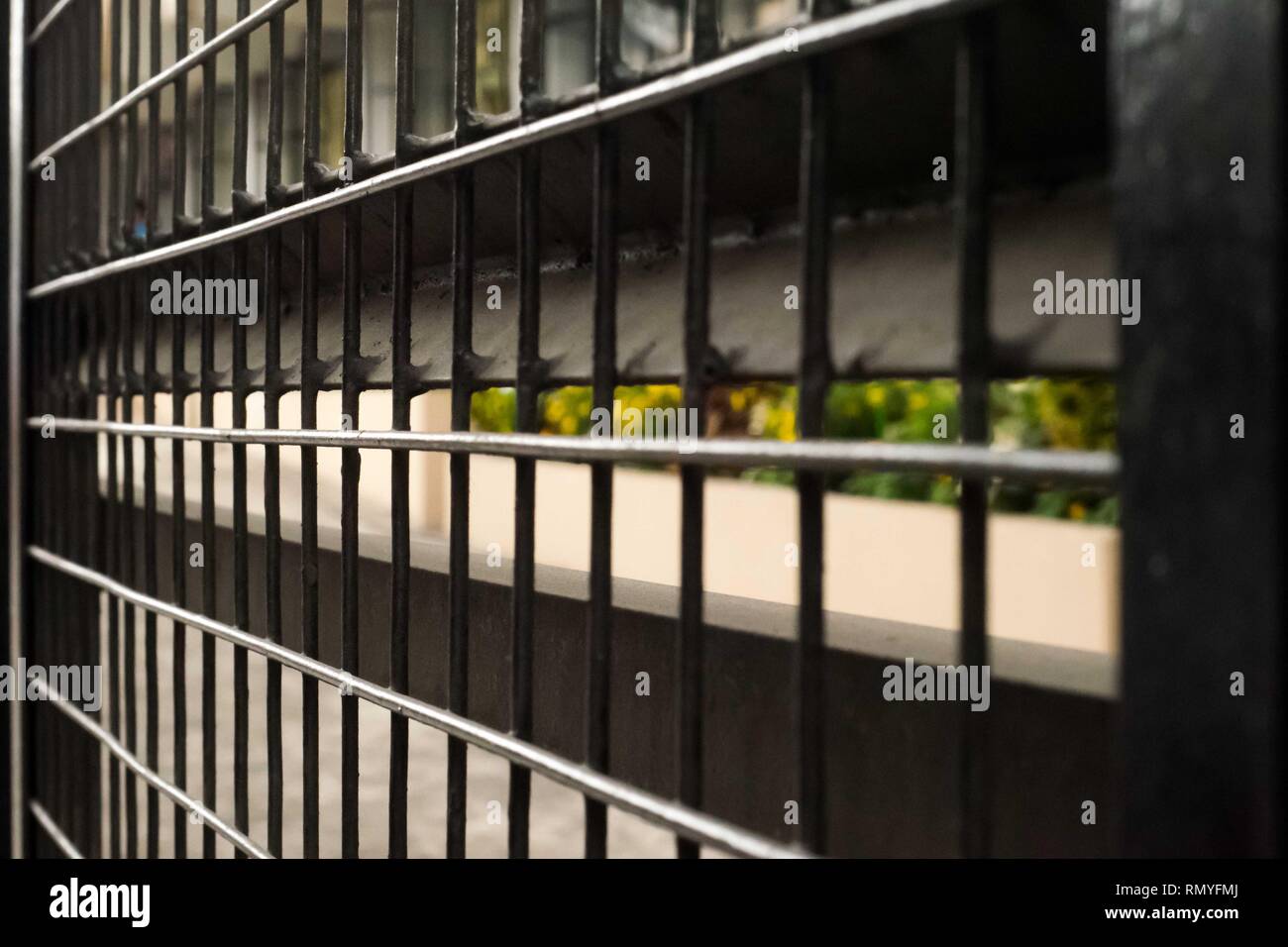 Black painted gate perspective pattern Stock Photo - Alamy