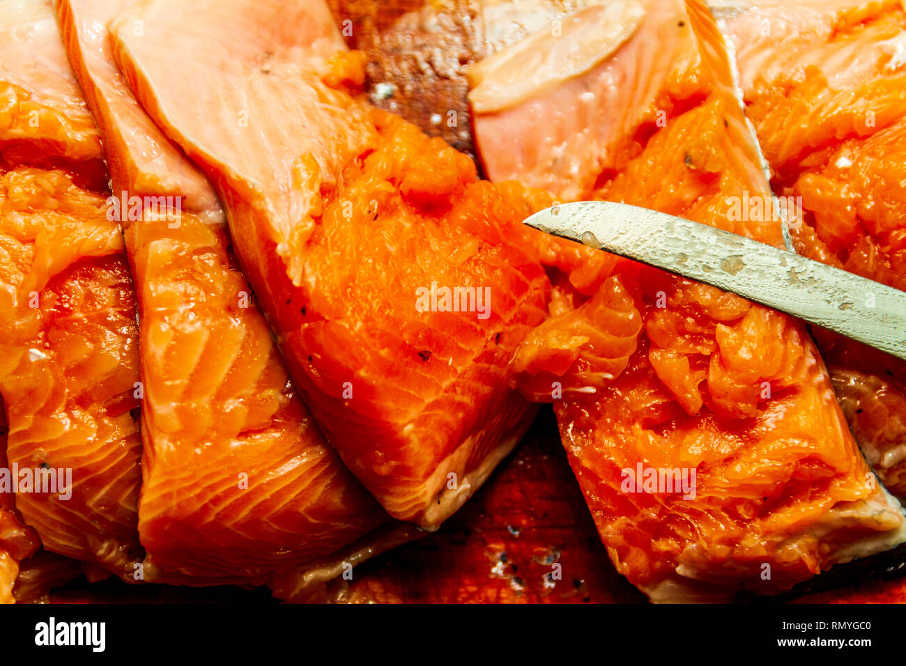 Cutting fish pieces hi-res stock photography and images - Alamy