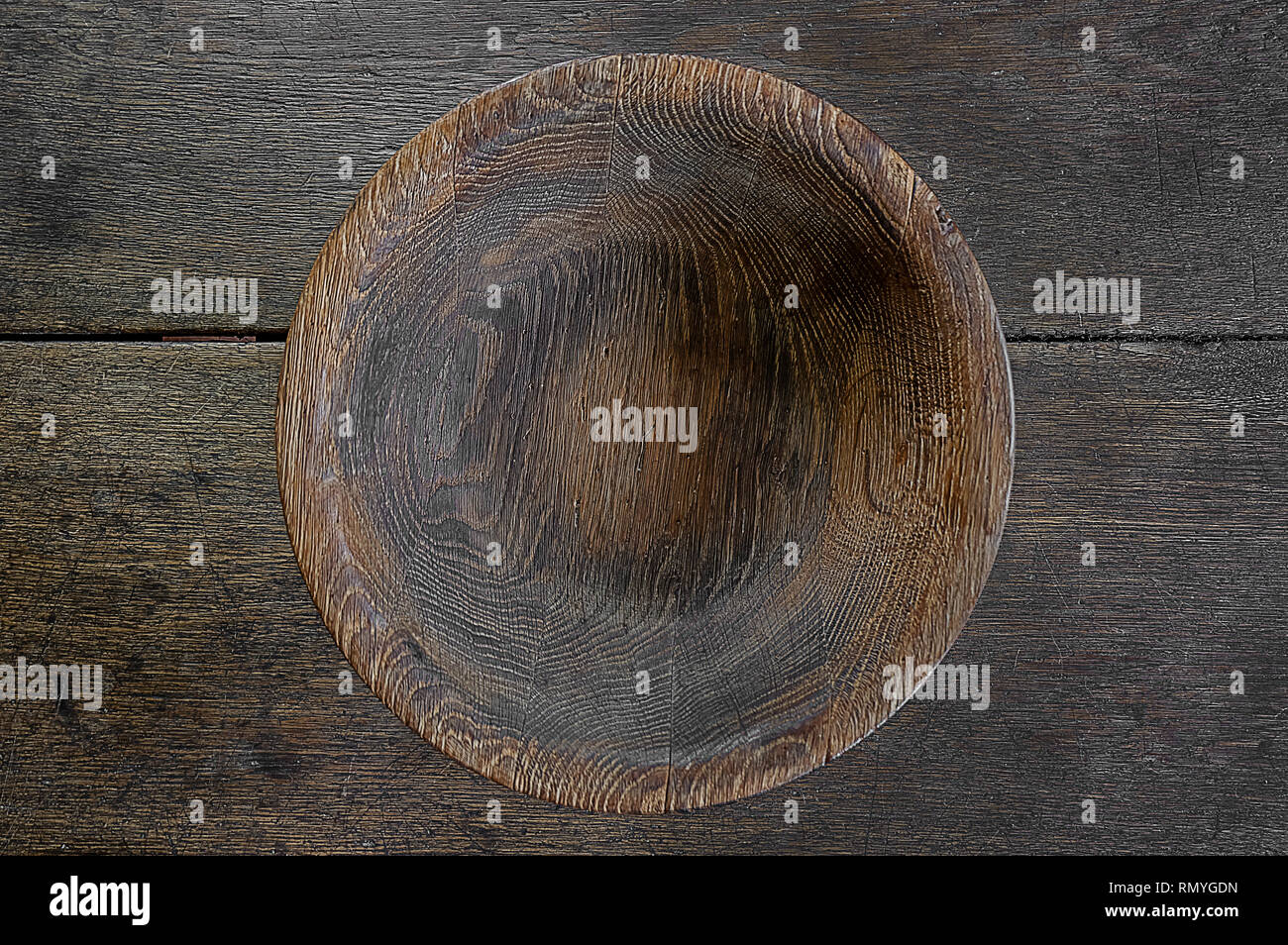 empty old wooden bowl on wooden table empty old wooden bowl on wooden ...