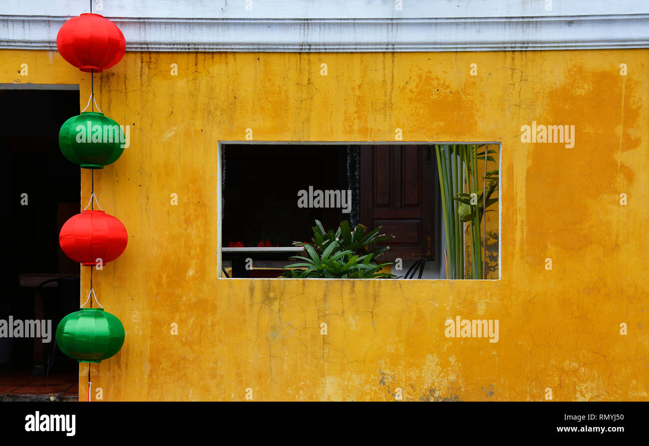 An old historic window in the historic UNESCO listed central Vietnamese ...