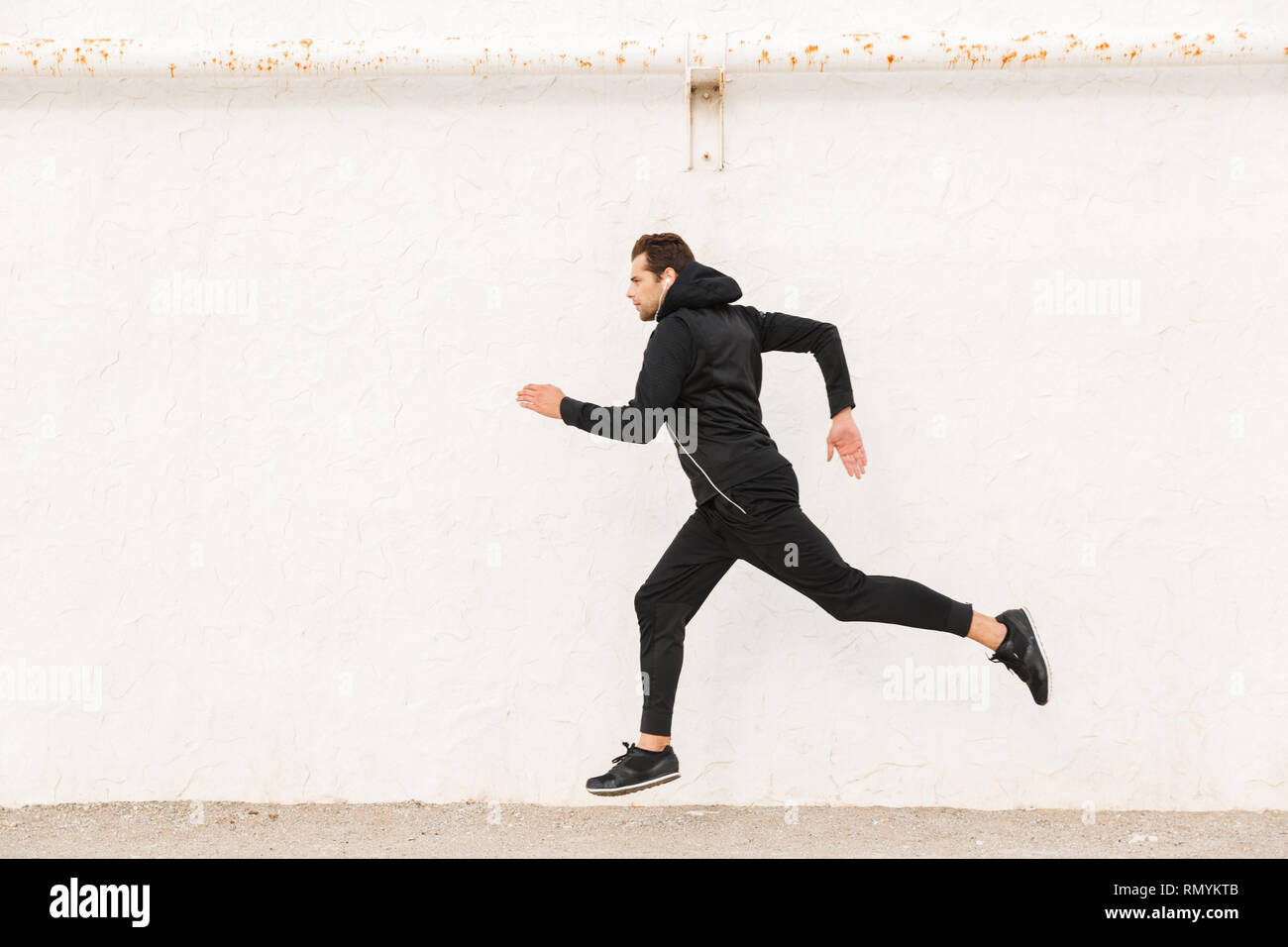 Man running up wall hi-res stock photography and images - Alamy