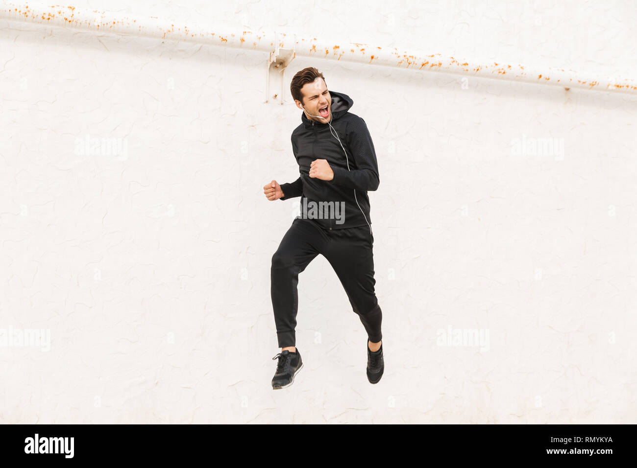 Man Running Up Wall High Resolution Stock Photography and Images - Alamy