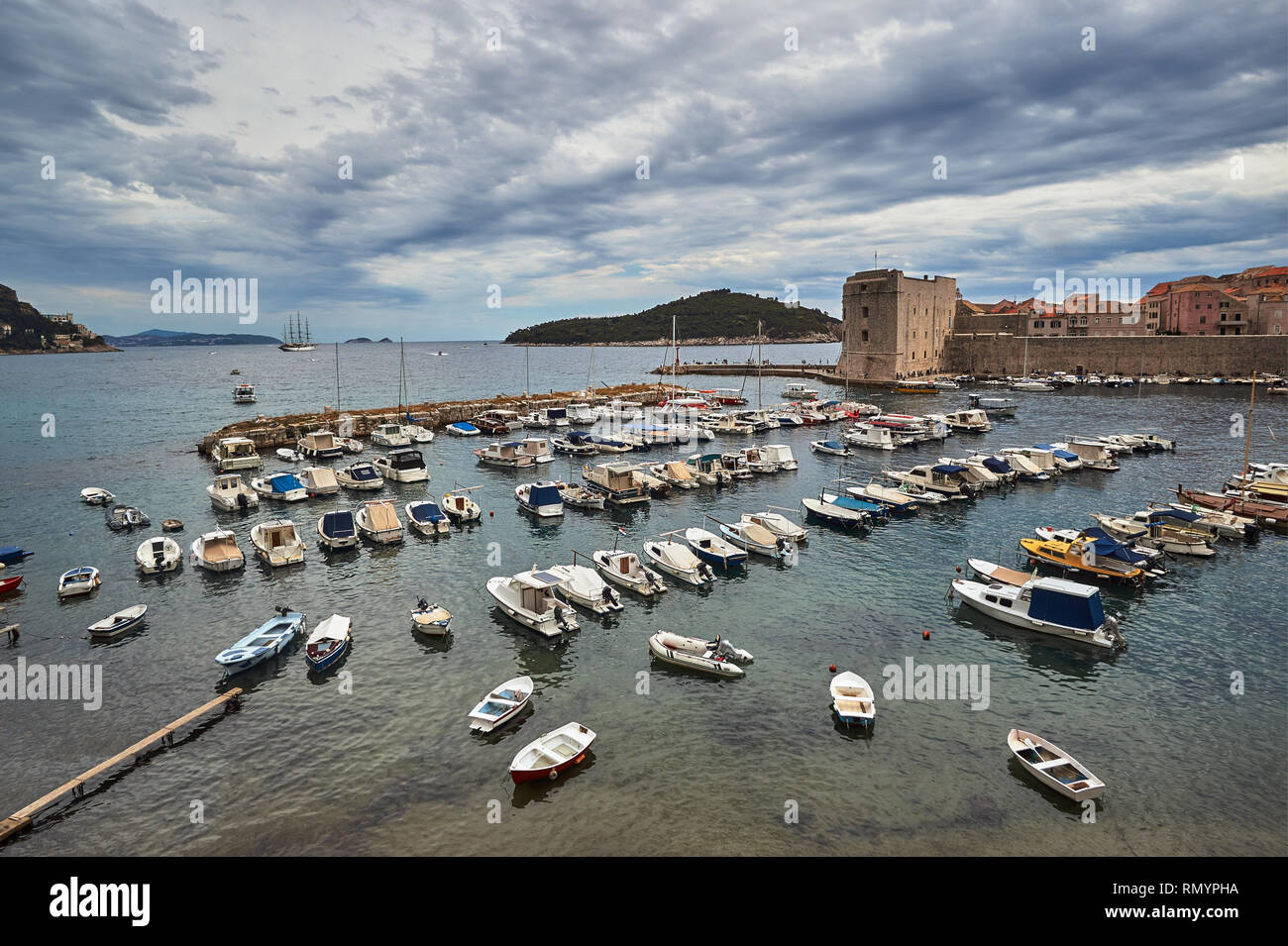 Medieval city walls and yacht harbor in the city of Dubrovnik, Croatia ...