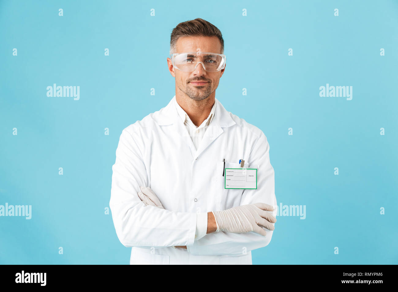 Confident man doctor wearing unifrom and glasses standing isolated over ...