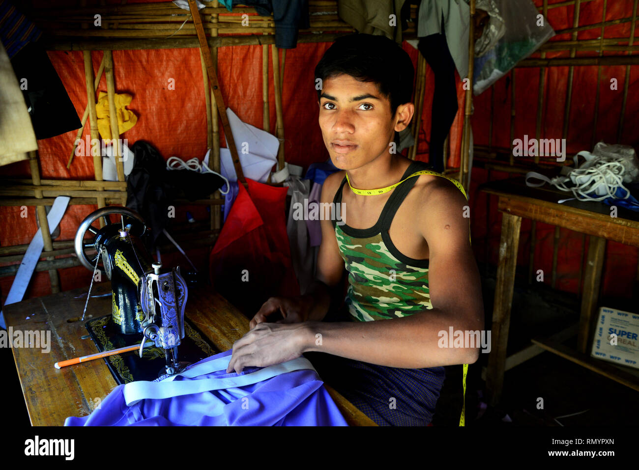 A Rohingya refugee tailor sewing clothe in the Balukhali refugee camp ...