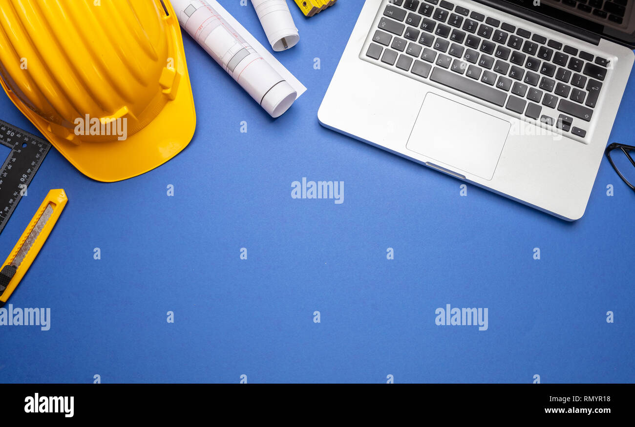 Architect engineer construction site office desk. Project blueprints ...