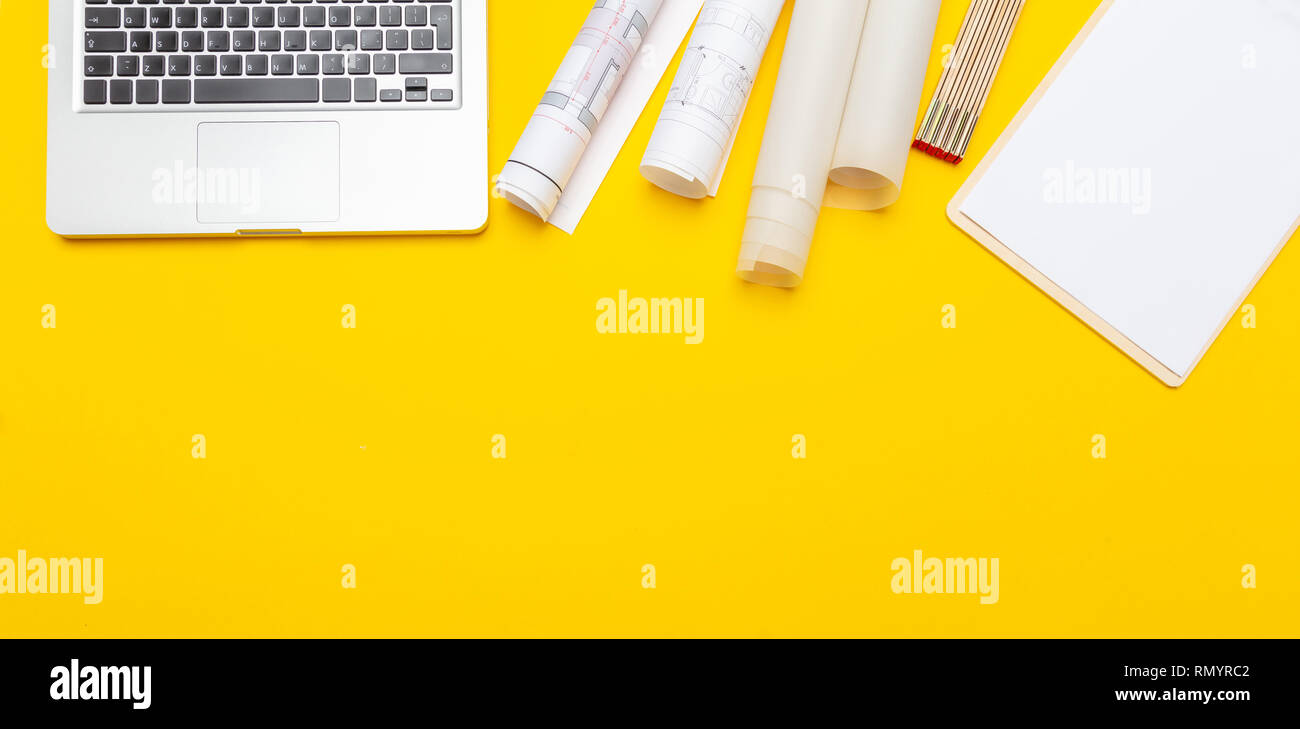 Architect engineer construction site office desk. Project blueprints ...