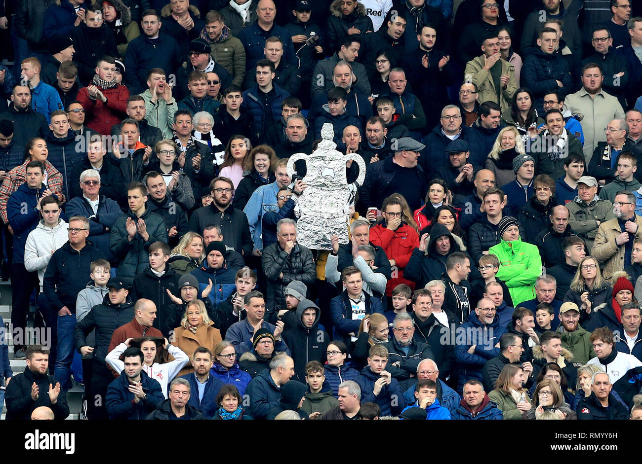 A general view of Derby County fans in the stands holding up a homemade ...