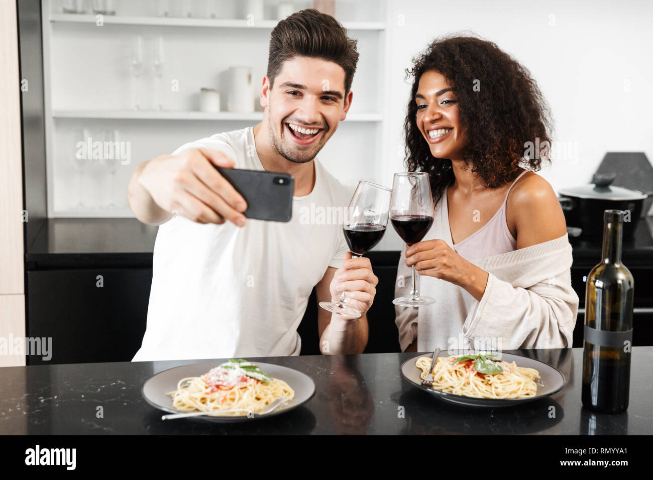 Young man taking pasta hi-res stock photography and images - Alamy