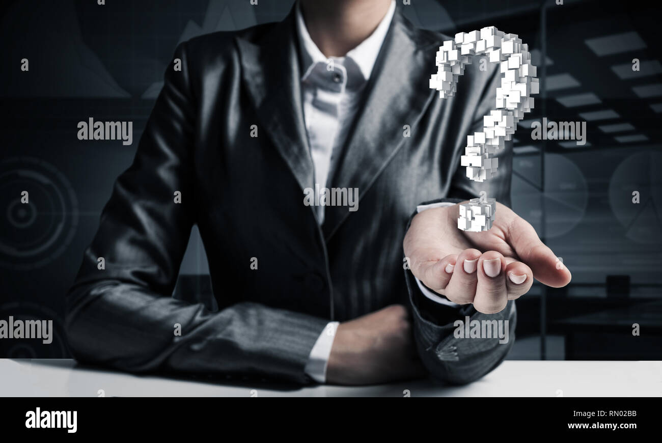 Businessman presenting question mark Stock Photo - Alamy