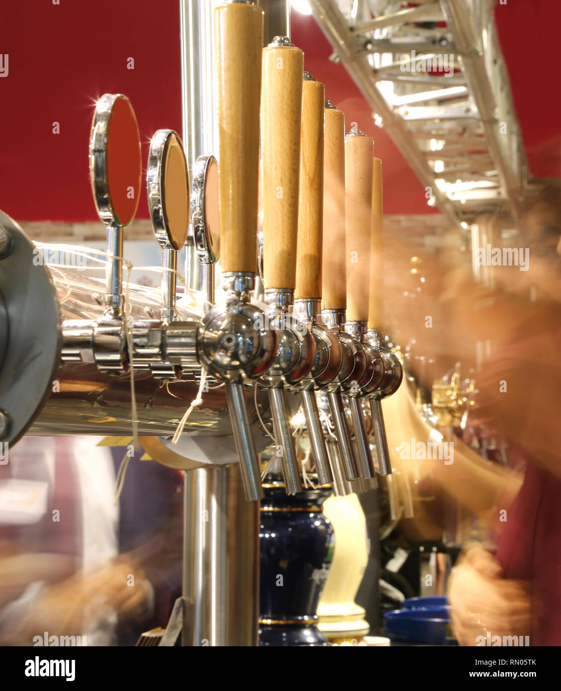 taps of a pub specializing in beers with the movement of the barman's ...