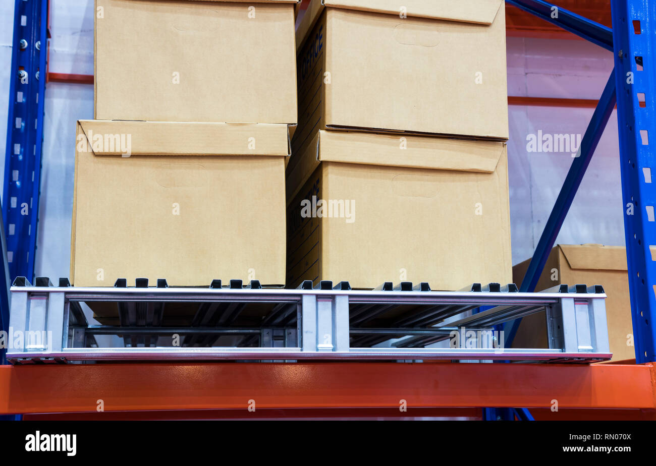 row of cotton boxes kept in warehouse shelves ; logistics Stock Photo ...