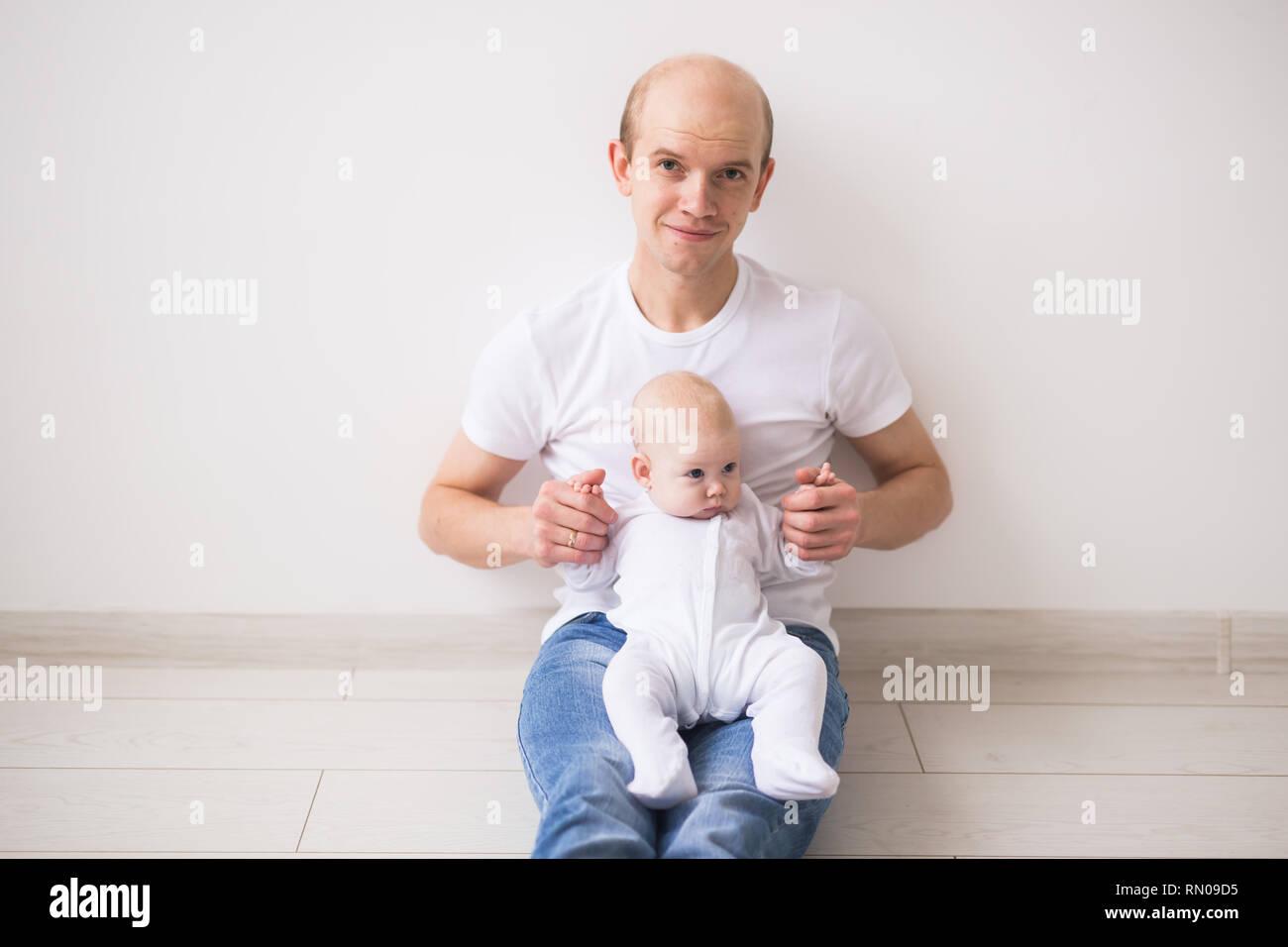 Children, family and fatherhood concept - happy bald father holding ...