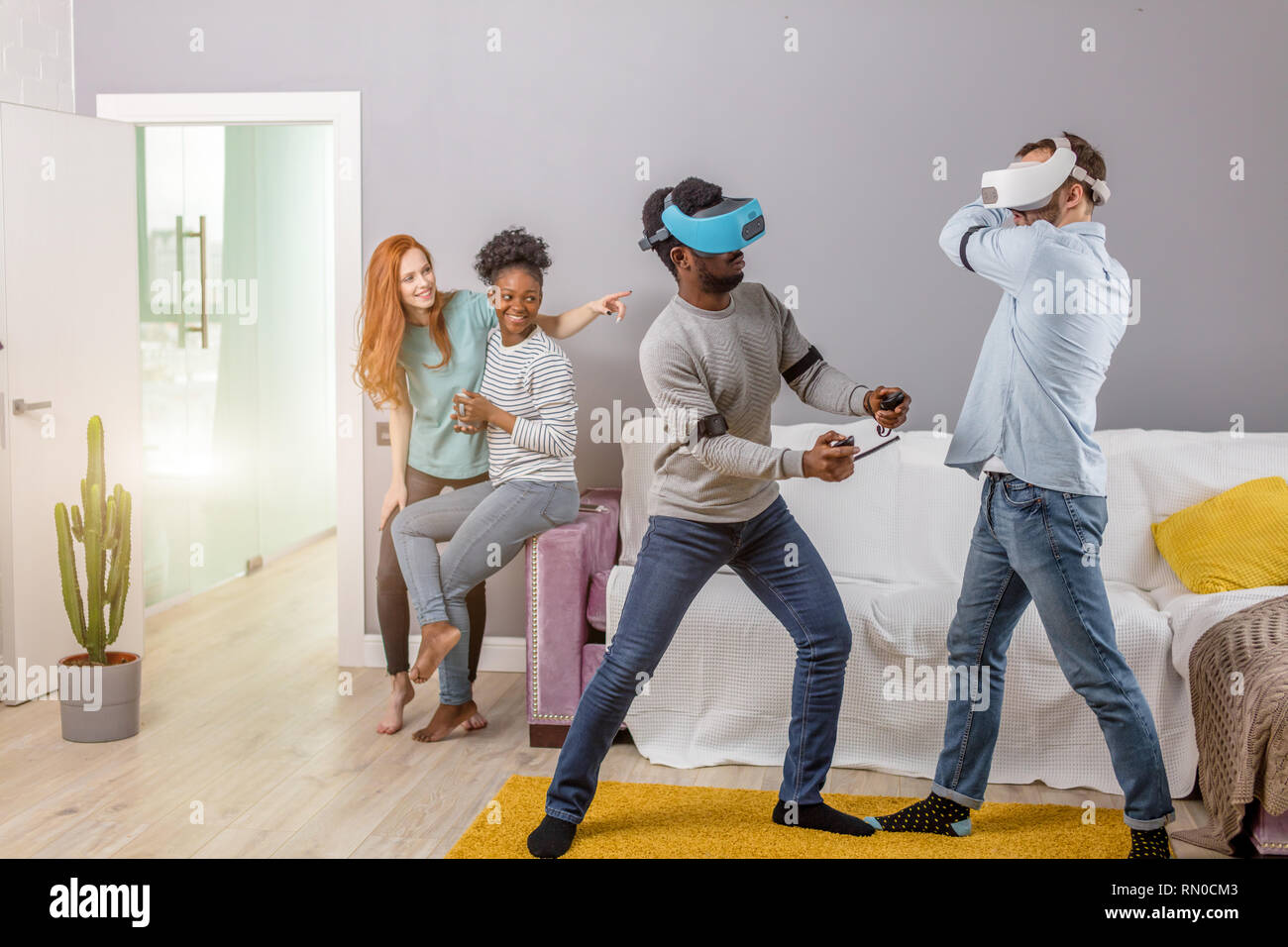 Multiethnic diverse friends enjoying VR technology, two guys wearing vr ...