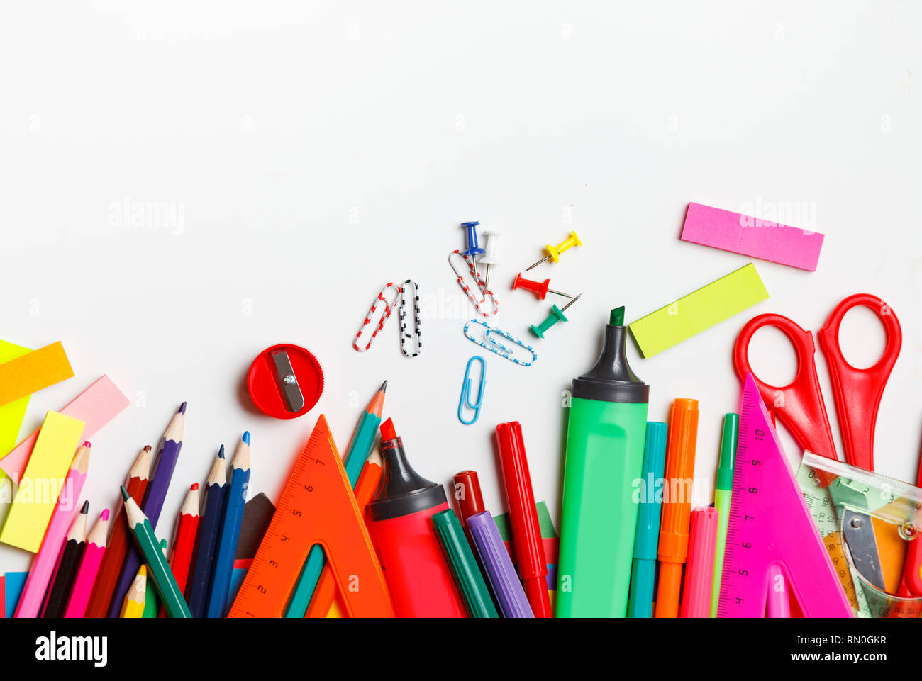Assorted school supplies, including pens, pencils, scissors, glue and a ...