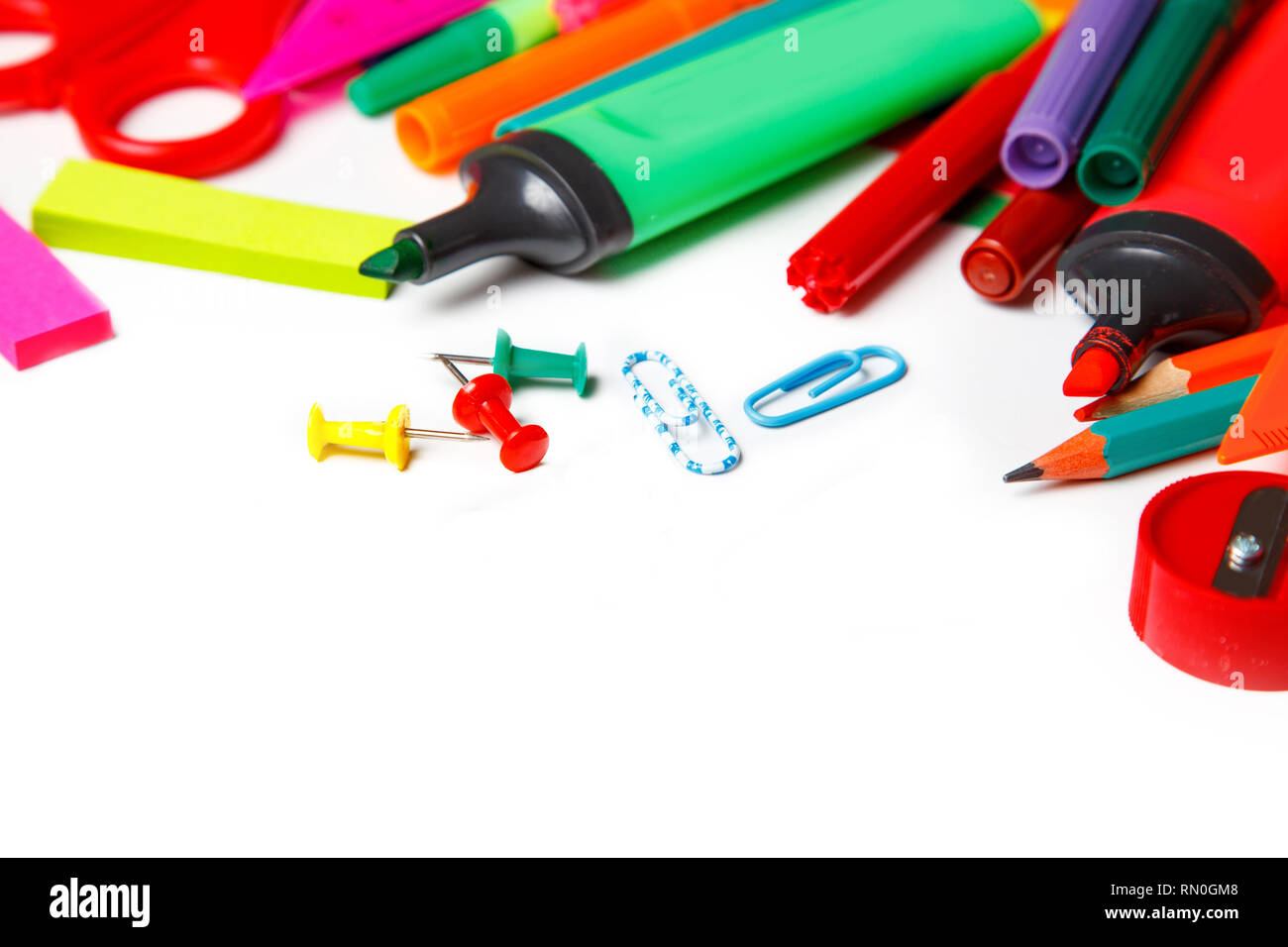 Assorted school supplies, including pens, pencils, scissors, glue and a ...